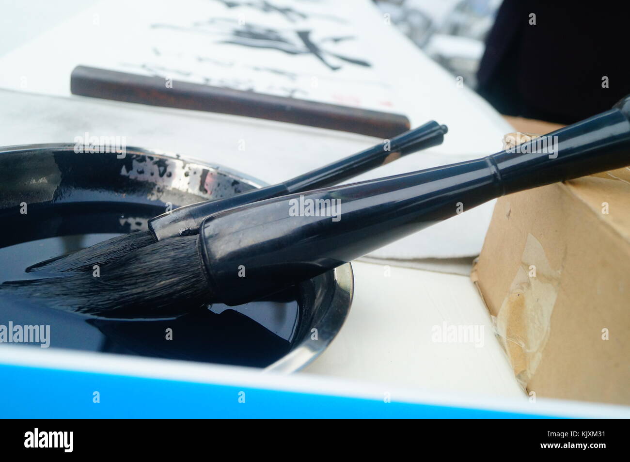 A Chinese calligraphy artist is selling his own calligraphy paintings ...