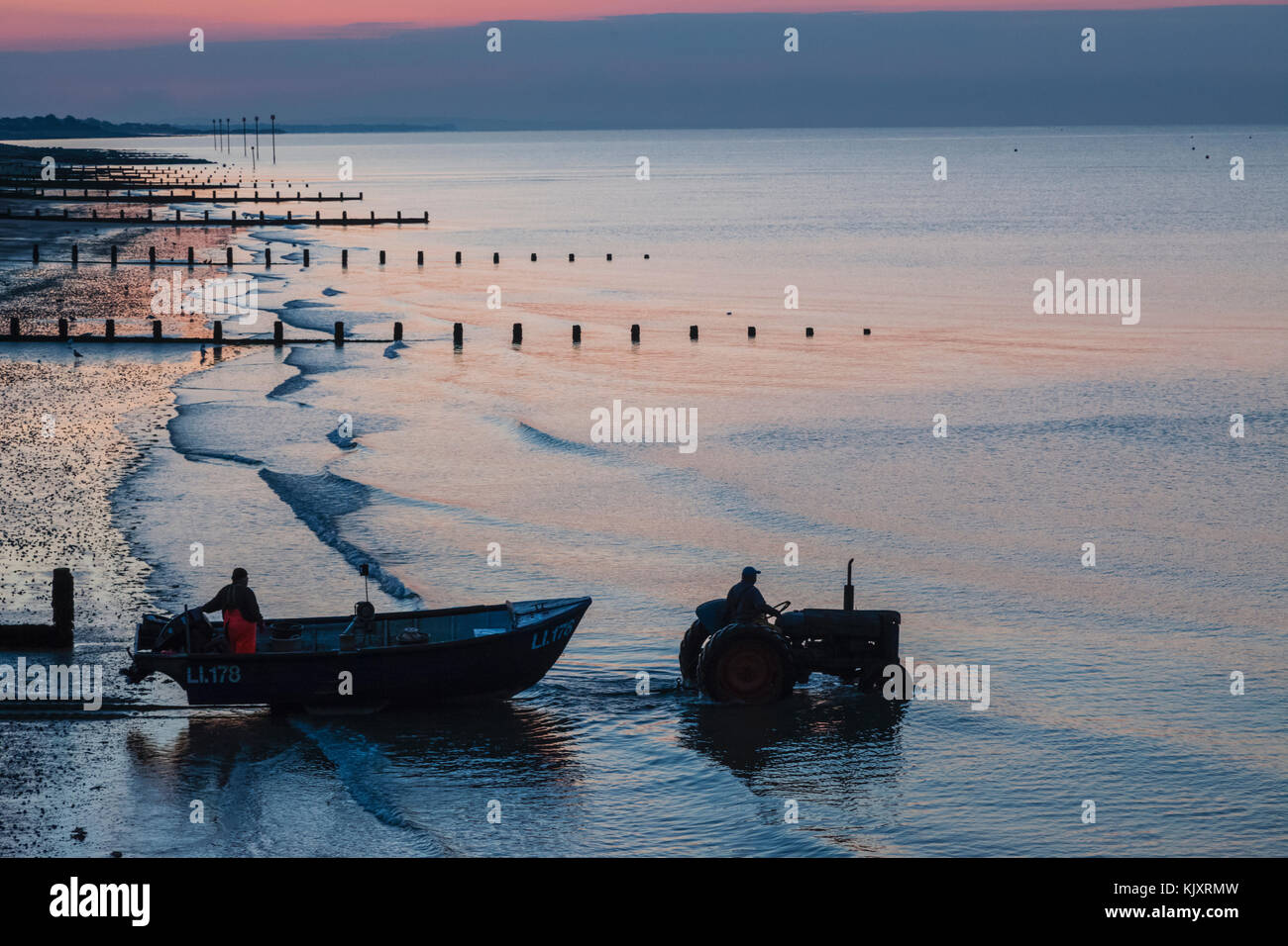 England, West Sussex, Bognor Regis, Fishermen Departing at Dawn Stock ...