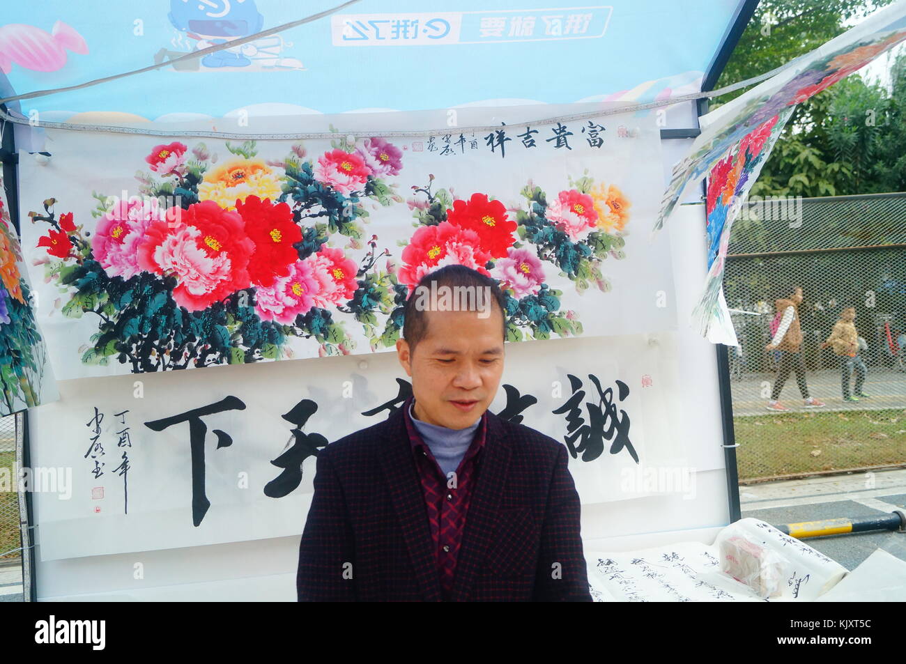 A Chinese calligraphy artist is selling his own calligraphy paintings ...