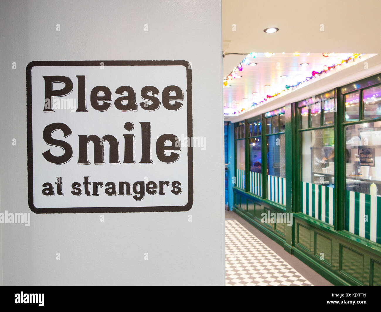 Please smile at strangers sign hi-res stock photography and images - Alamy