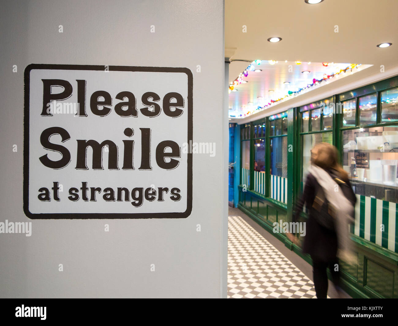 Please smile at strangers sign hi-res stock photography and images - Alamy
