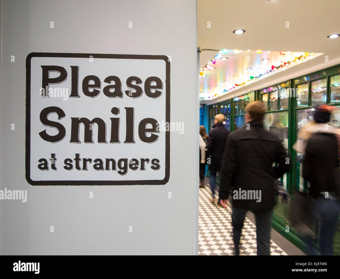 Please smile at strangers sign hi-res stock photography and images - Alamy