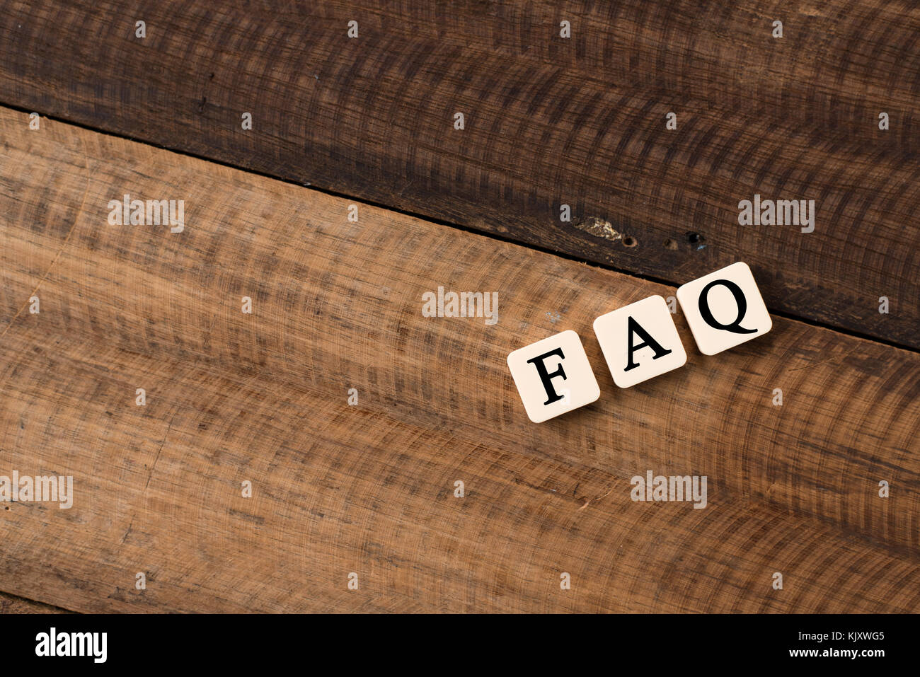 Frequently Asked Question concept. FAQ word on alphabet tiles on wooden ...