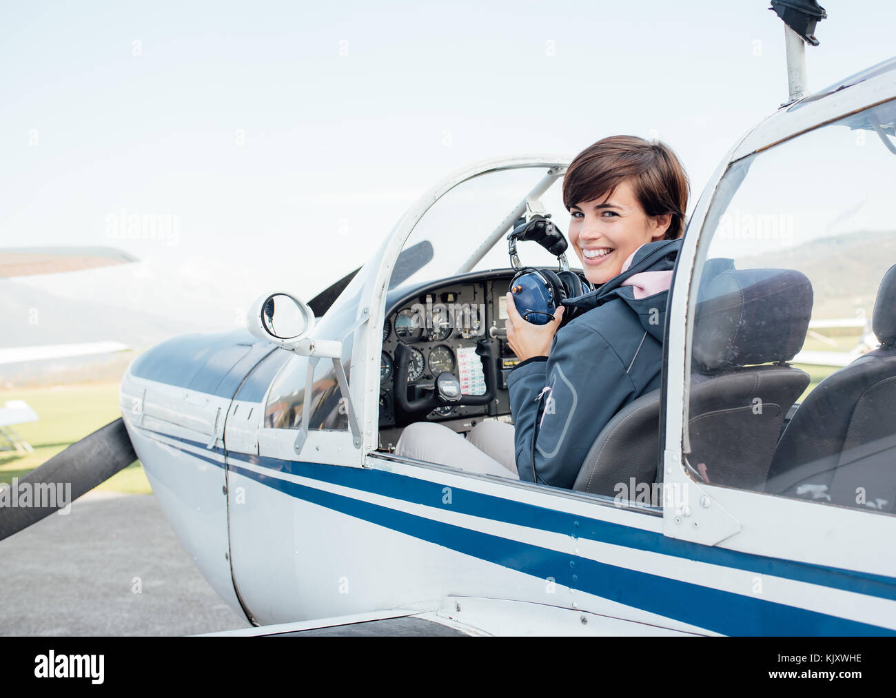 Female pilot smiling in cockpit hi-res stock photography and images - Alamy