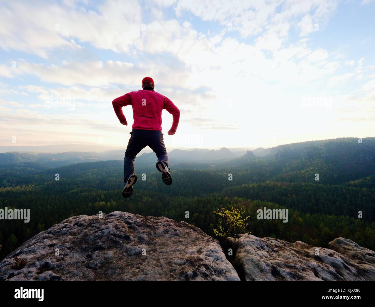 Man dangerously jumping on the edge. Man jump. Young man falling down ...