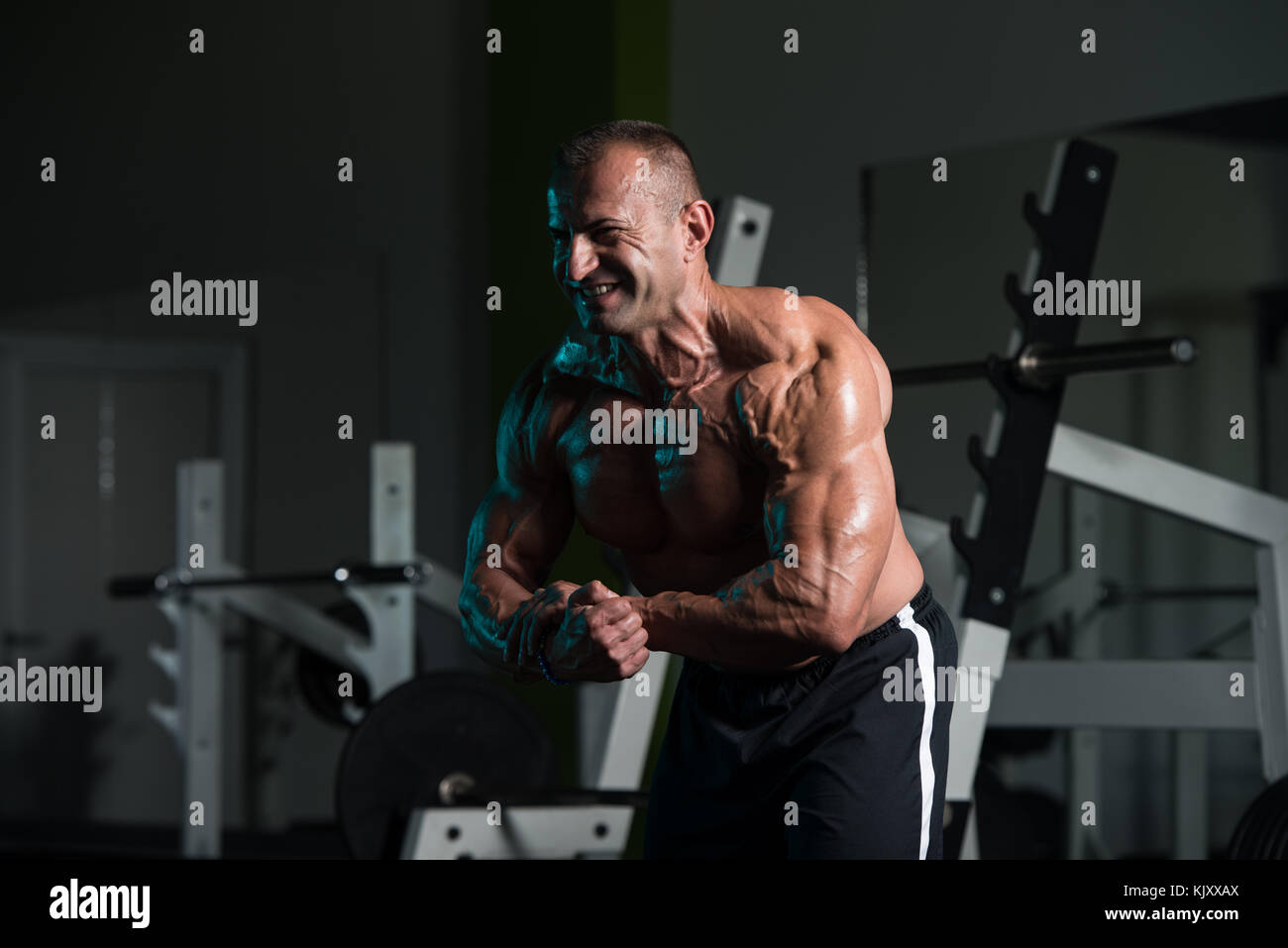 Portrait Of A Mature Physically Fit Man Showing His Well Trained Body ...