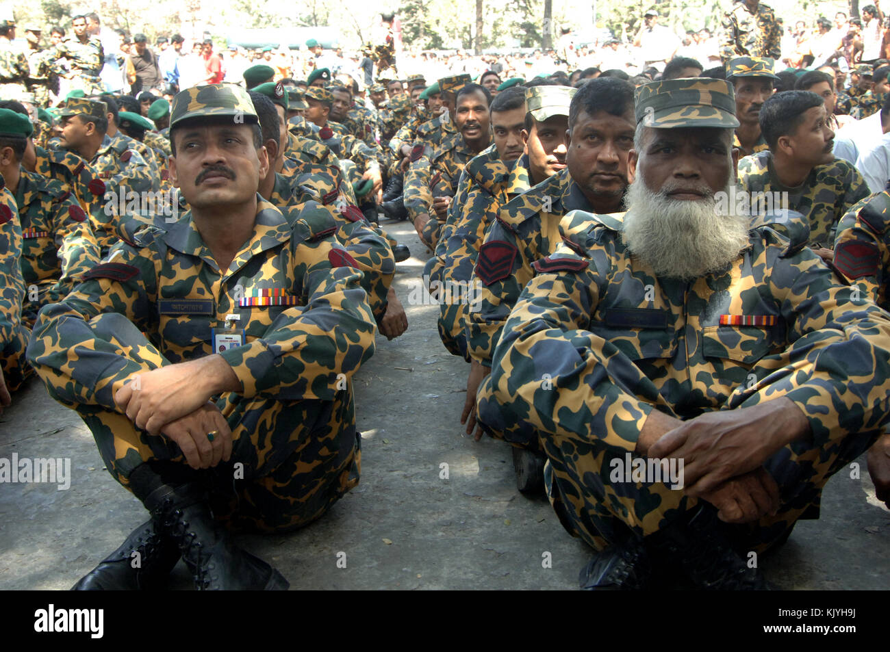 DHAKA, BANGLADESH – MARCH 01, 2009: Bangladeshi border guards sit at ...