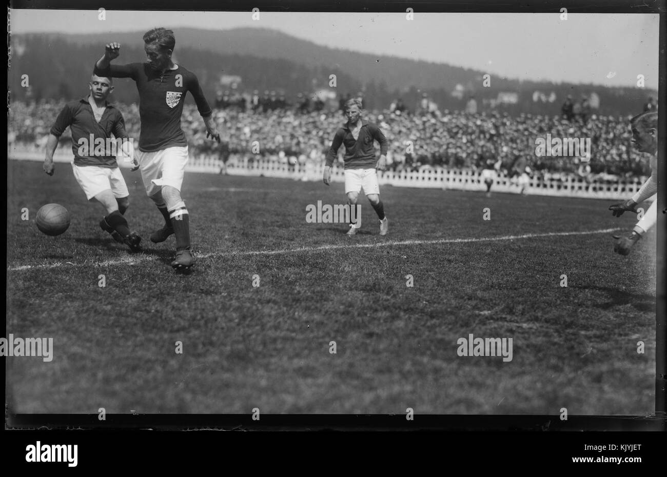 A 1919 photograph of a football match, capturing players in action ...