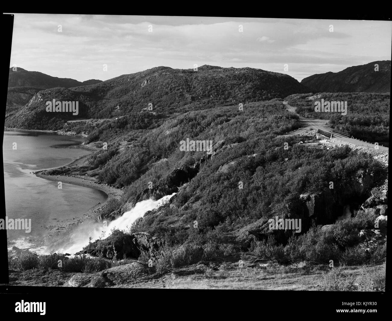 This photograph depicts the Tana River, Adamsfoss waterfall, and ...