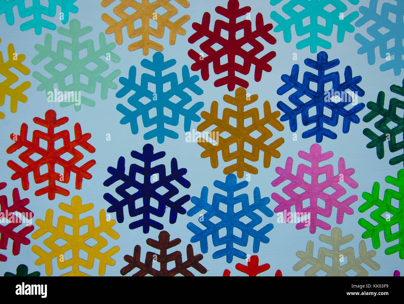 Colourful snowflakes on white wood background Stock Photo - Alamy