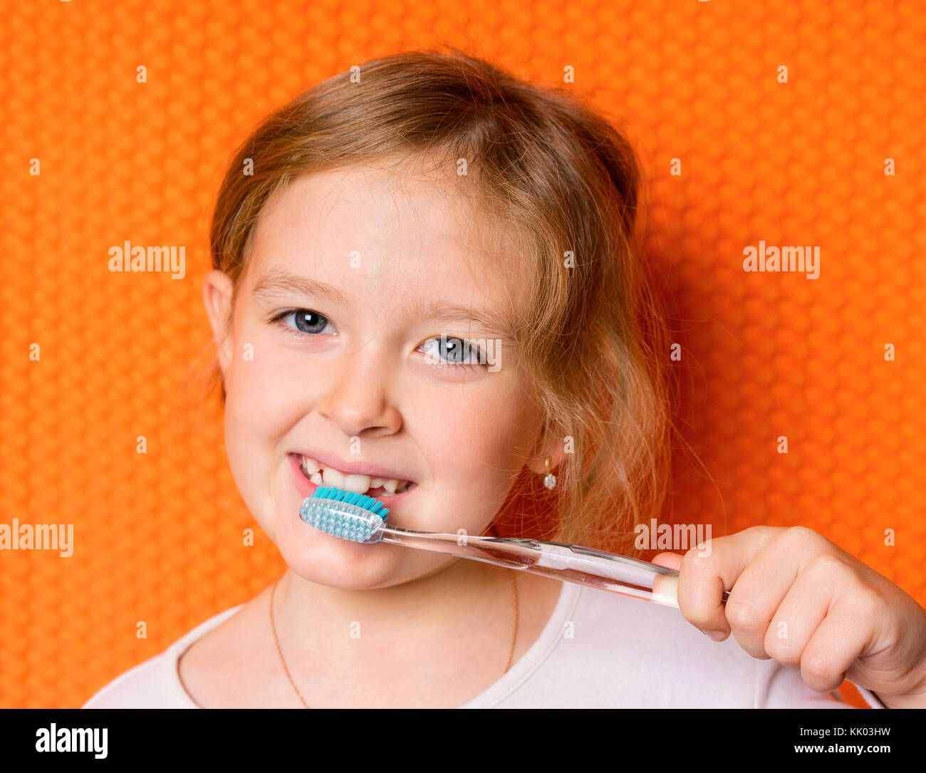 little girl with toothbrush on black background Stock Photo - Alamy