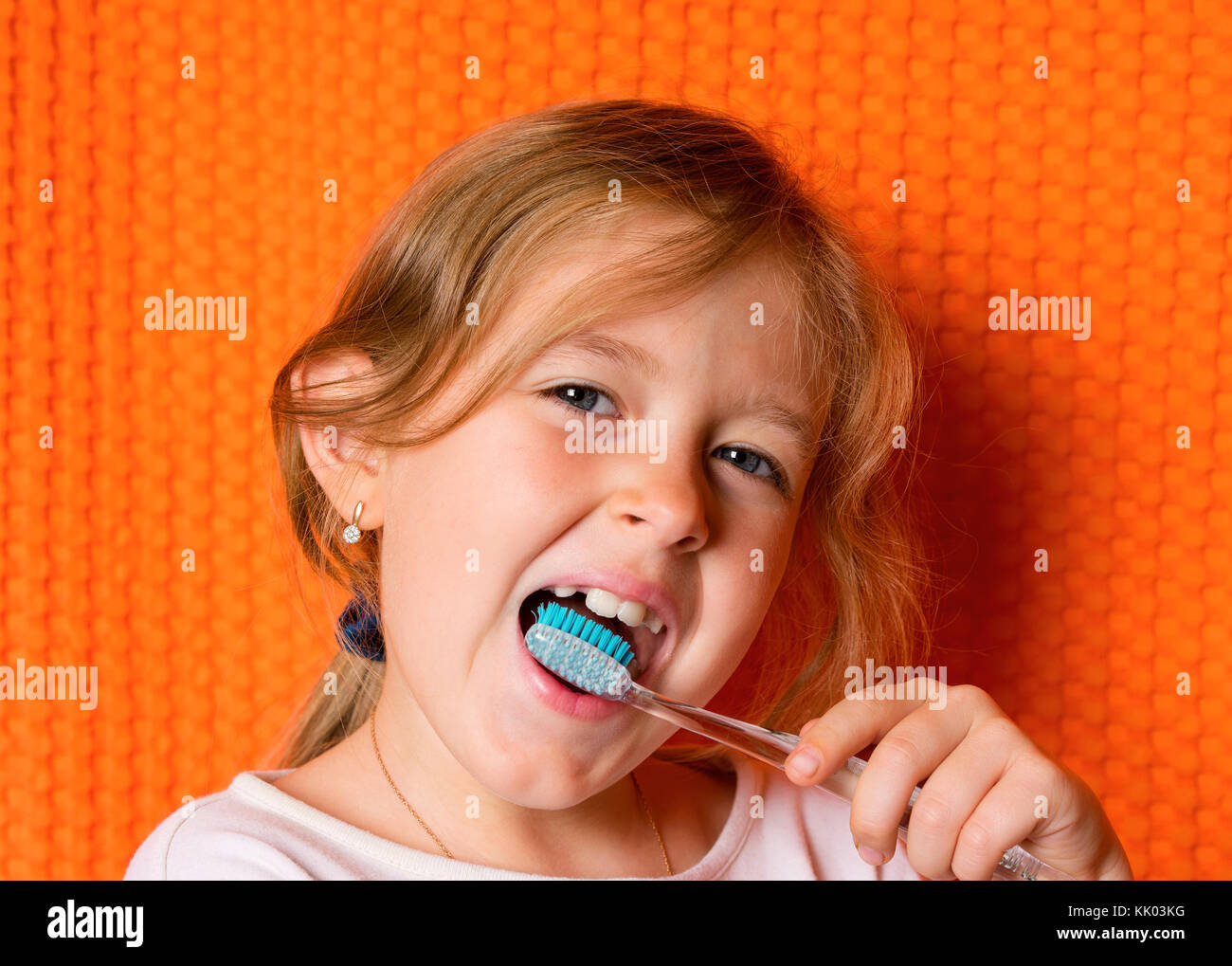 little girl with toothbrush on black background Stock Photo - Alamy