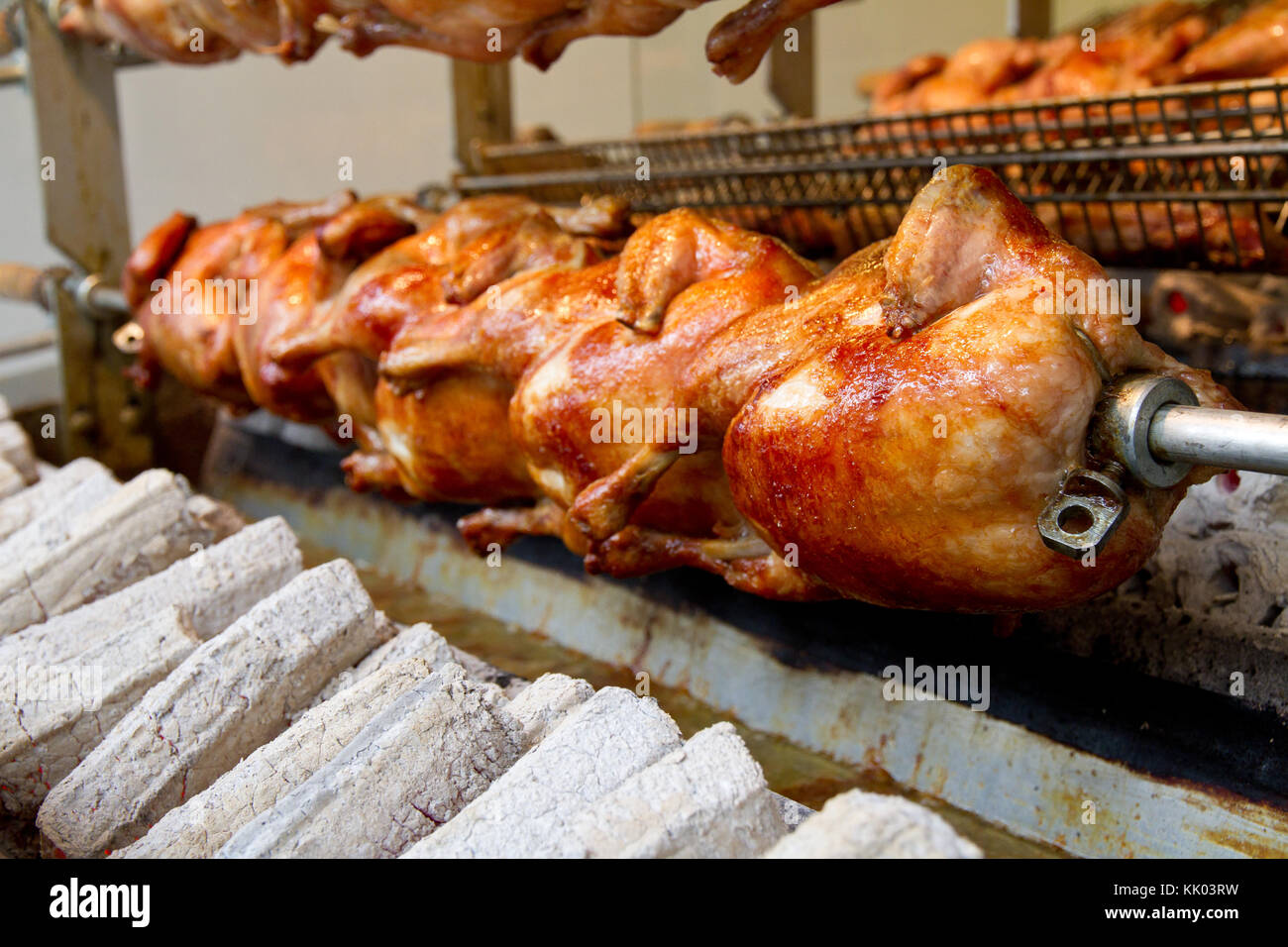 Chicken being cooked over coal Stock Photo - Alamy