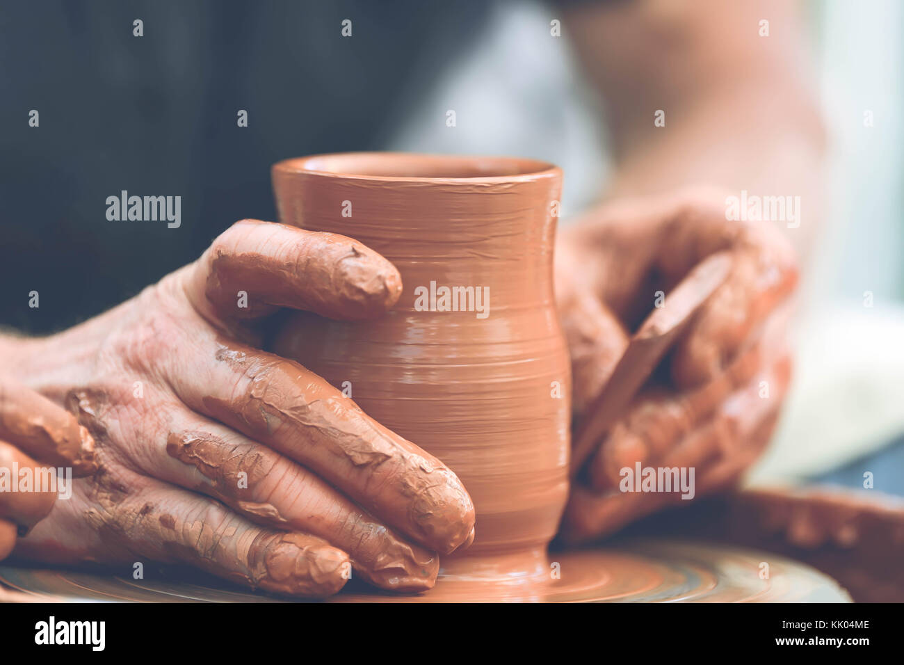 Hands of a potter. Potter making ceramic pot on the pottery wheel Stock ...
