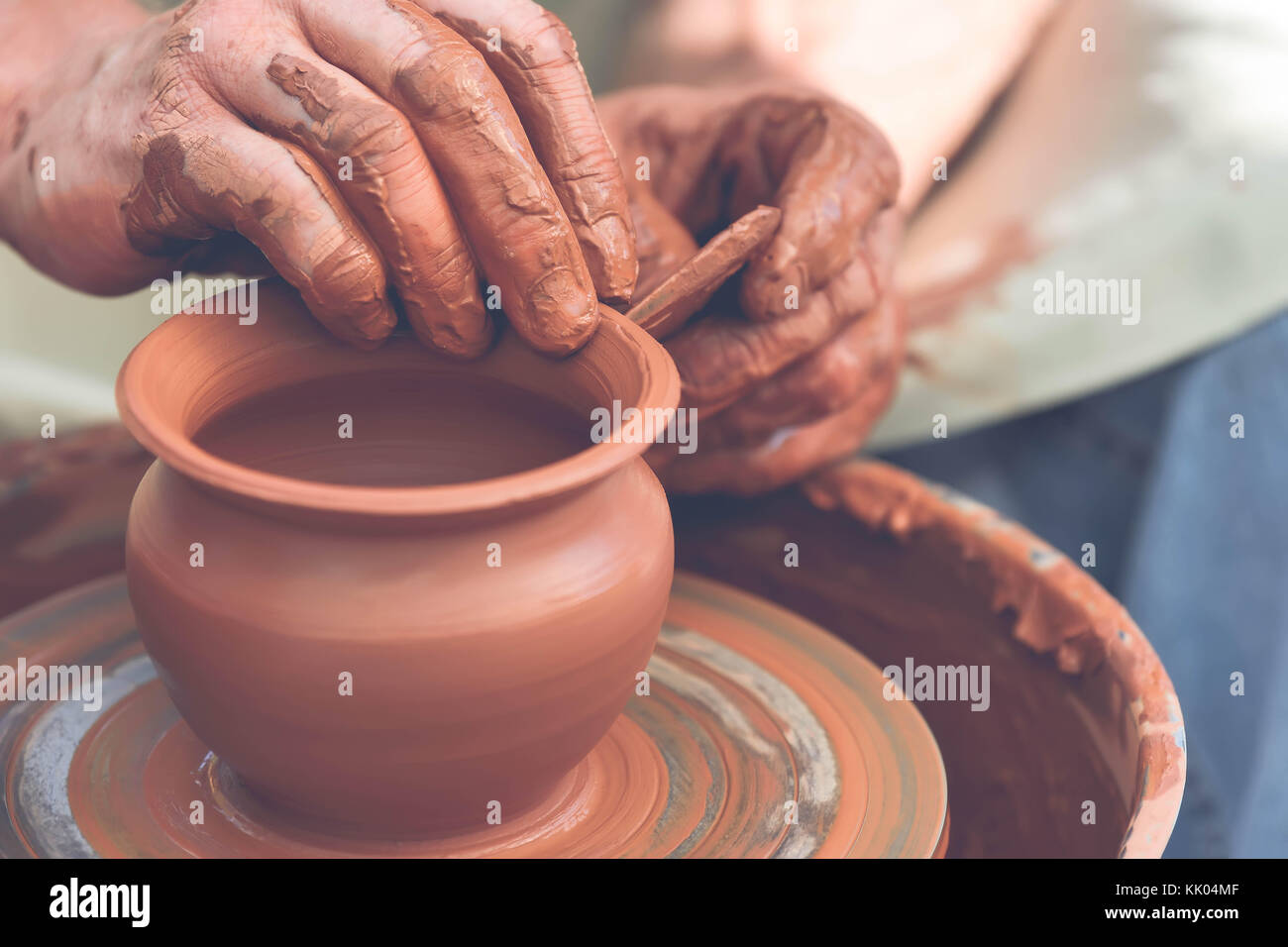 Hands of a potter. Potter making ceramic pot on the pottery wheel Stock ...