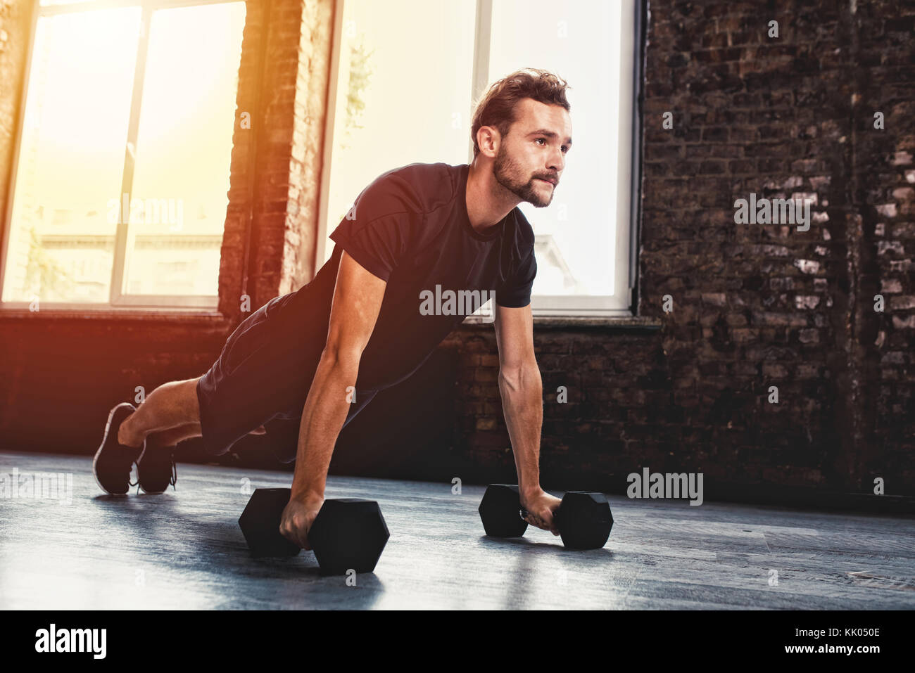 Man doing pushups at the gym Stock Photo - Alamy