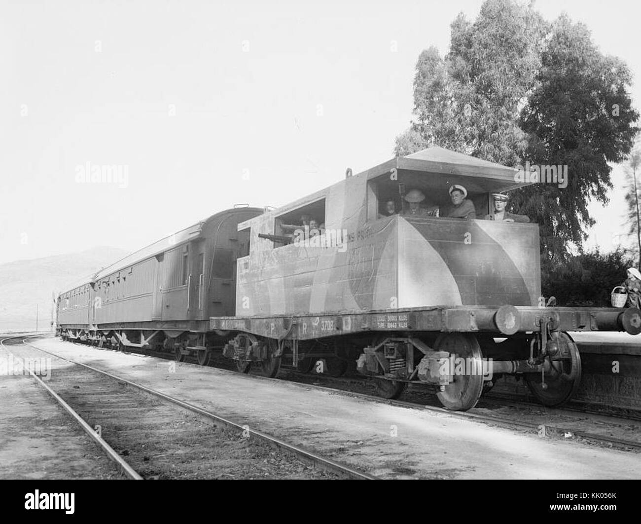 Armoured concrete coach escorting passenger train Stock Photo - Alamy