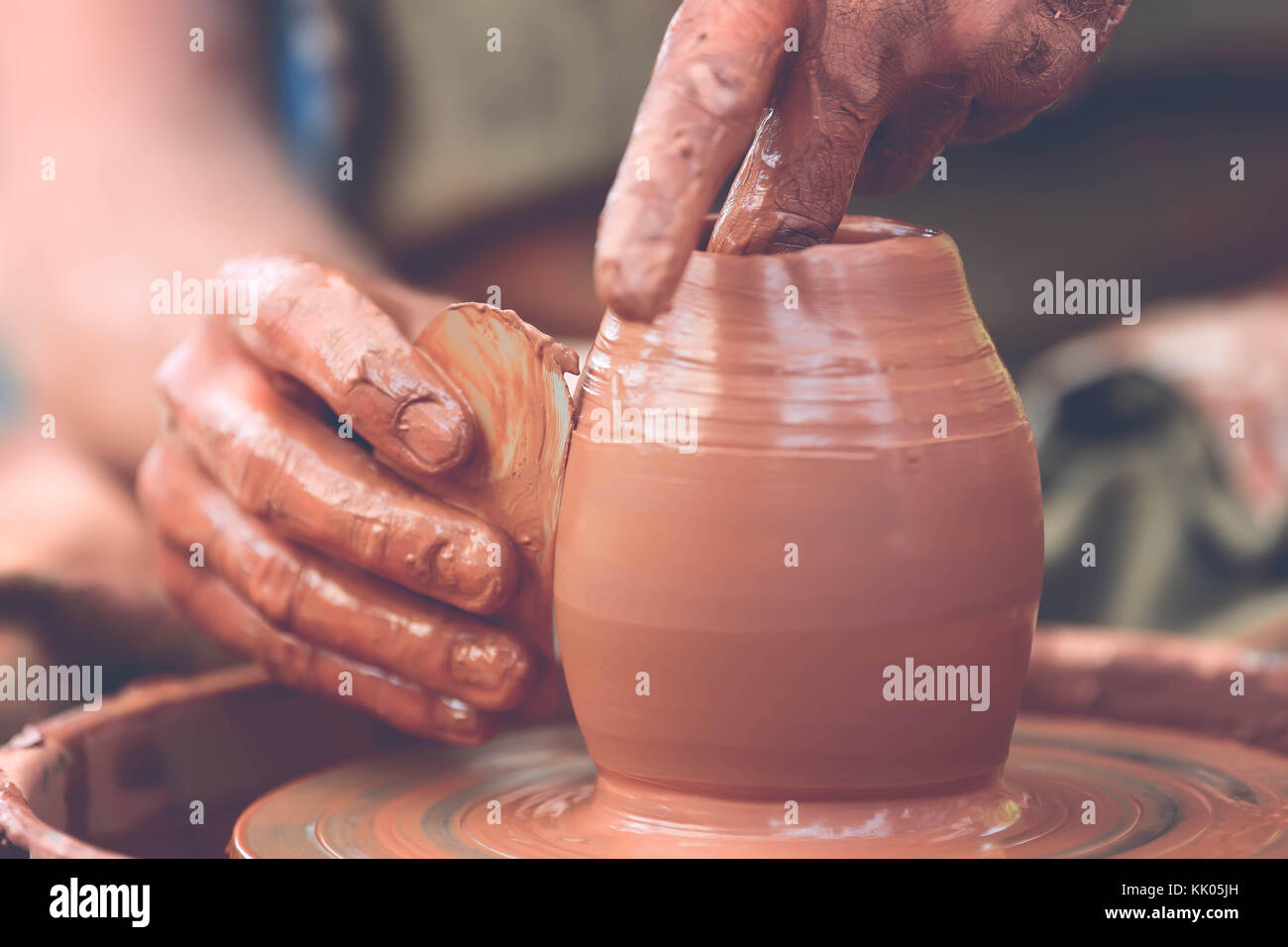 Hands of a potter. Potter making ceramic pot on the pottery wheel Stock ...