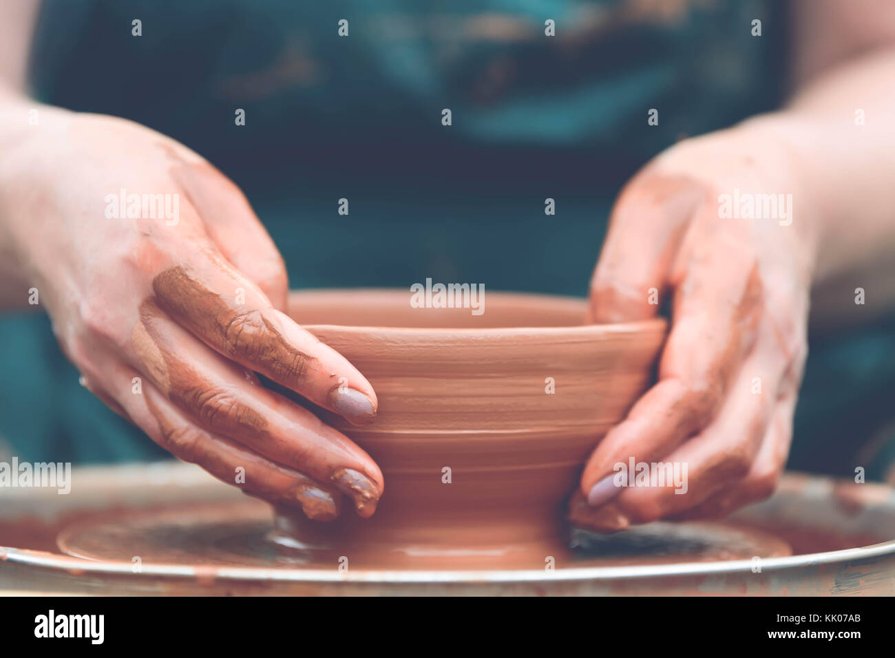 Hands of a potter. Potter making ceramic pot on the pottery wheel Stock ...