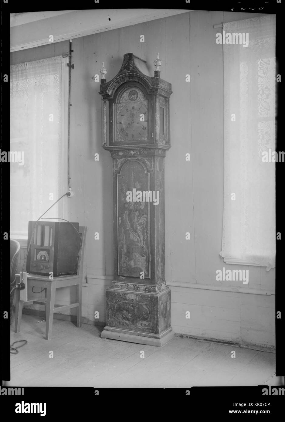 This photograph features a traditional clock case from Heddal, Norway ...