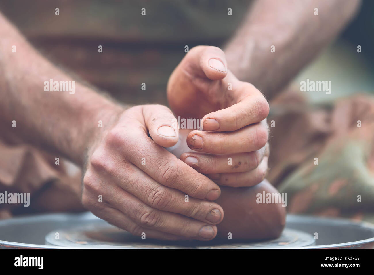 Hands of a potter. Potter making ceramic pot on the pottery wheel Stock ...