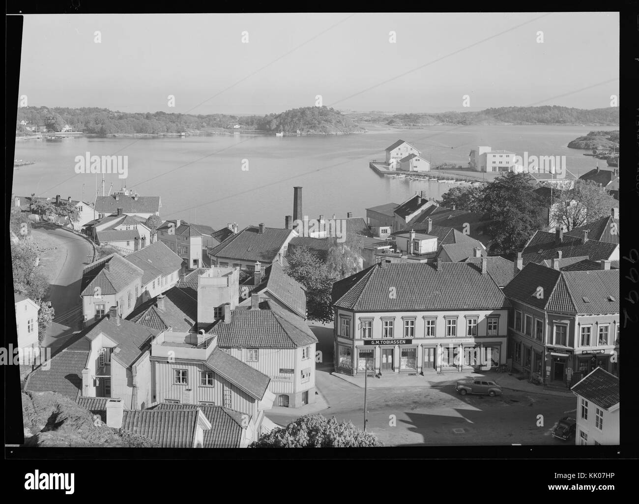 This historical photograph of Grimstad, Norway, captures the town's ...