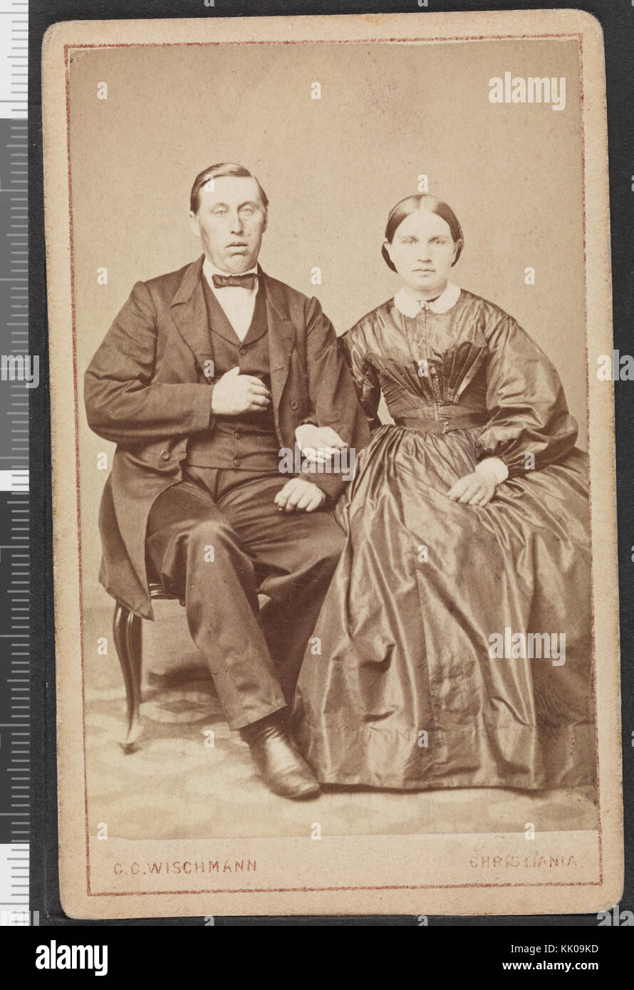 This studio portrait features an unidentified couple seated in full ...