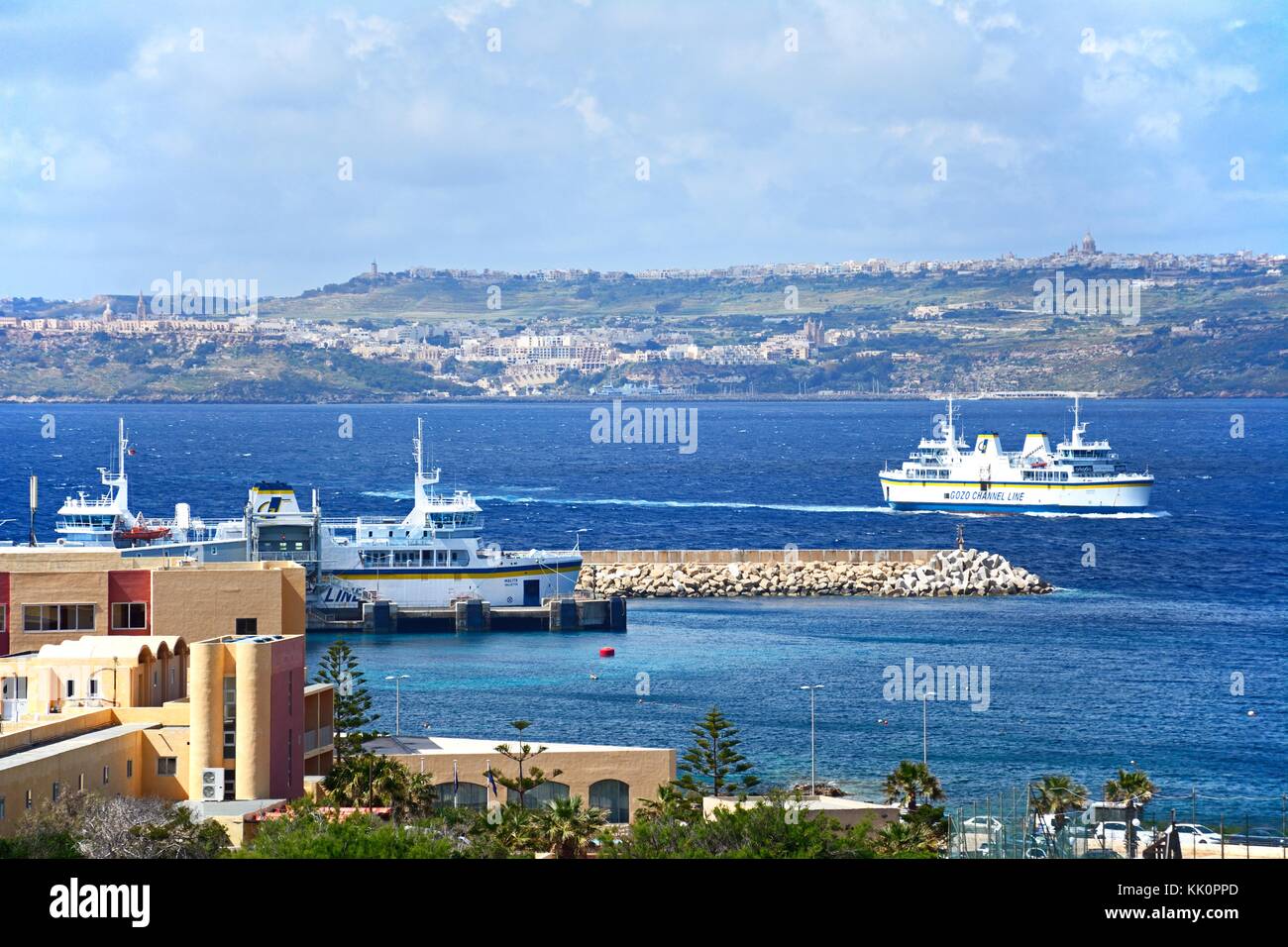 Gozo ferry in the ferry terminal with views towards Gozo, Paradise Bay ...