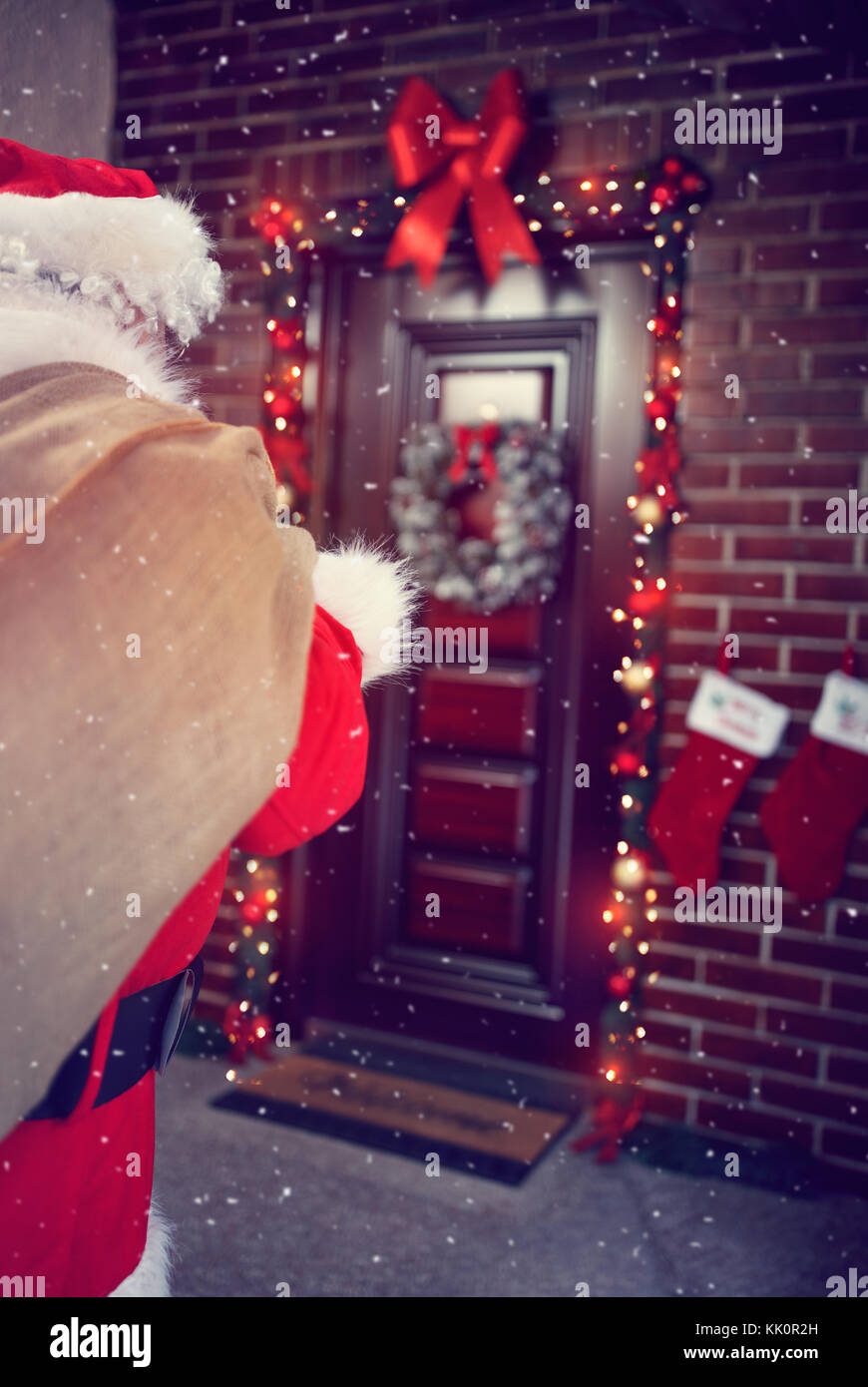 Coming of Santa Clause with gifts in sack in home Stock Photo - Alamy