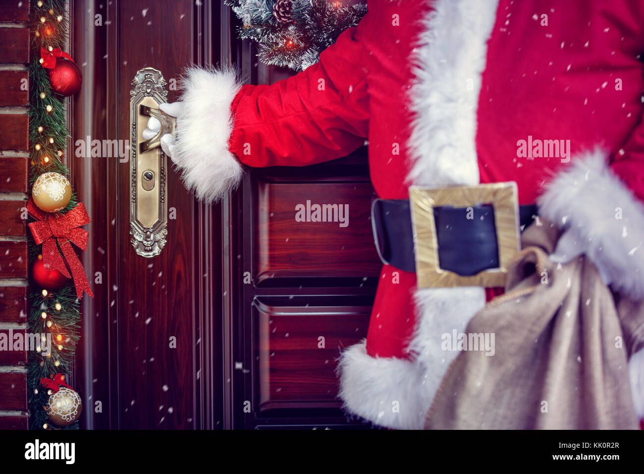 Concept of Santa Claus entering in house for Christmas Stock Photo - Alamy