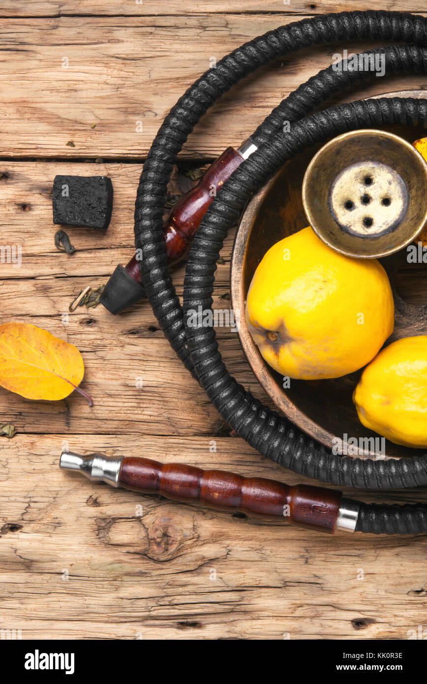 Smoking smoking hookah in Arabic style with the tobacco aroma quince ...