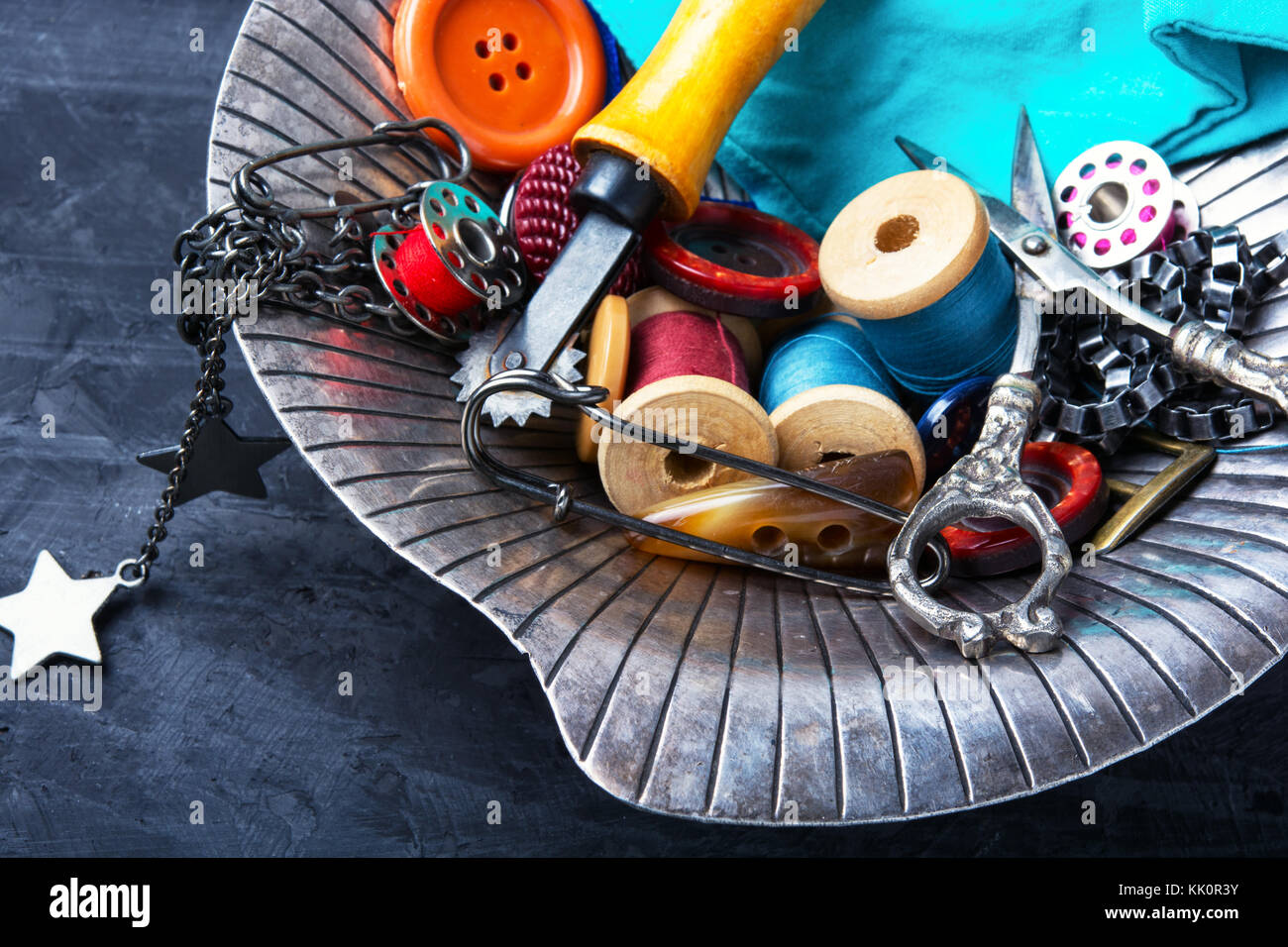 Stylish metal vase with a set of sewing accessories Stock Photo - Alamy