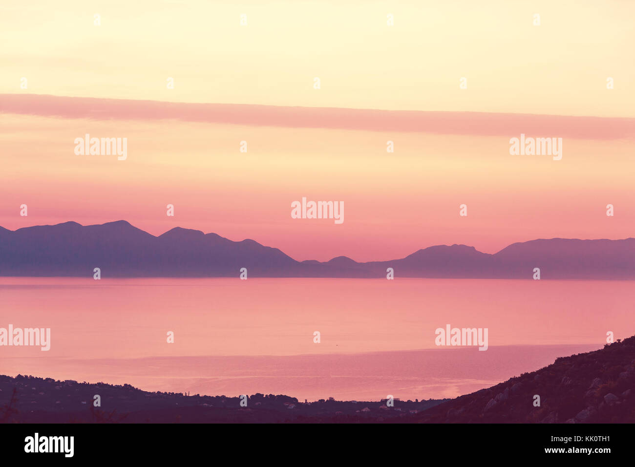 Beautiful sunset on Greek coast Stock Photo - Alamy
