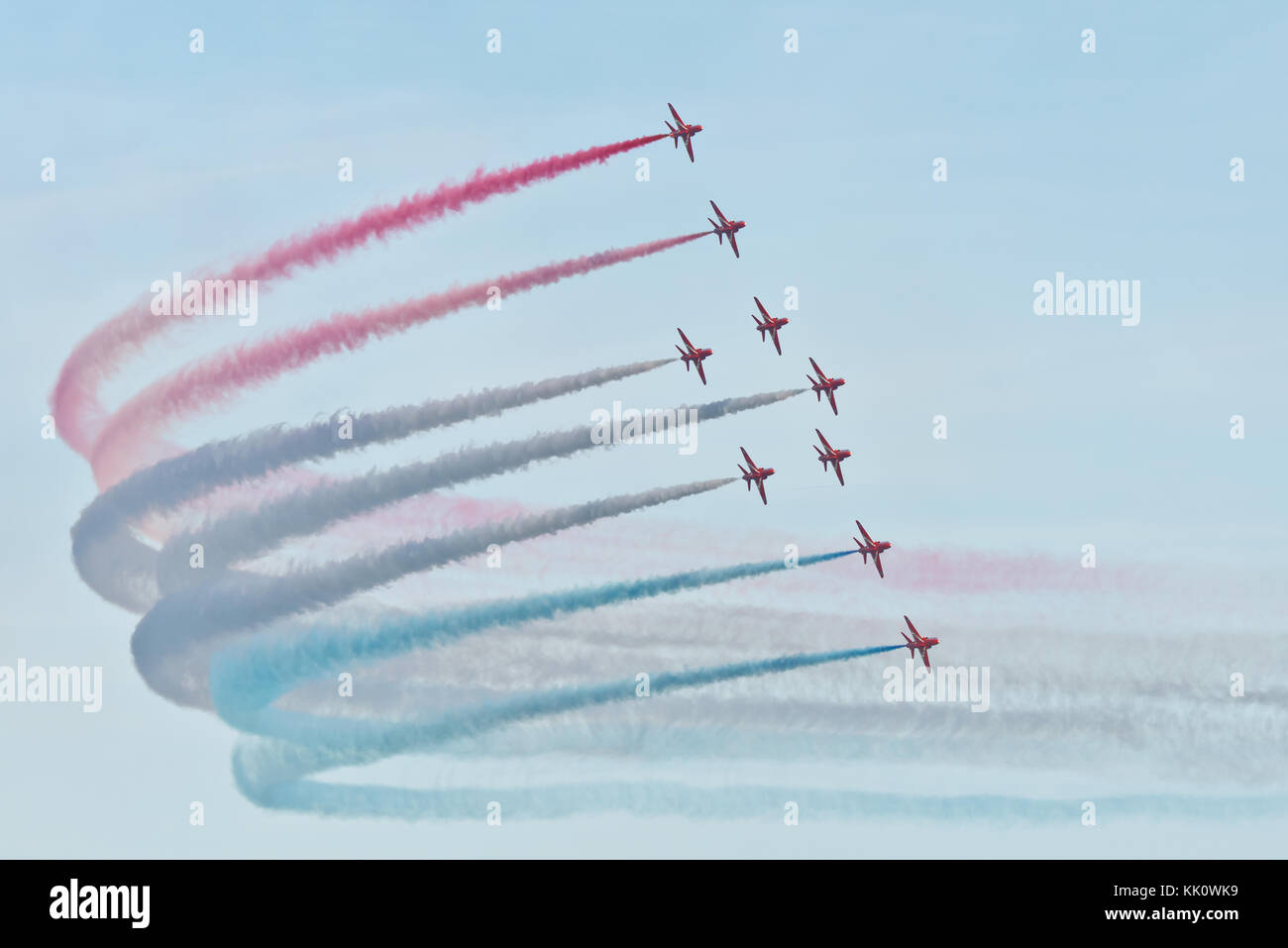 The RAFs Red Arrows performing the "nine arrow to phoenix" as part of ...