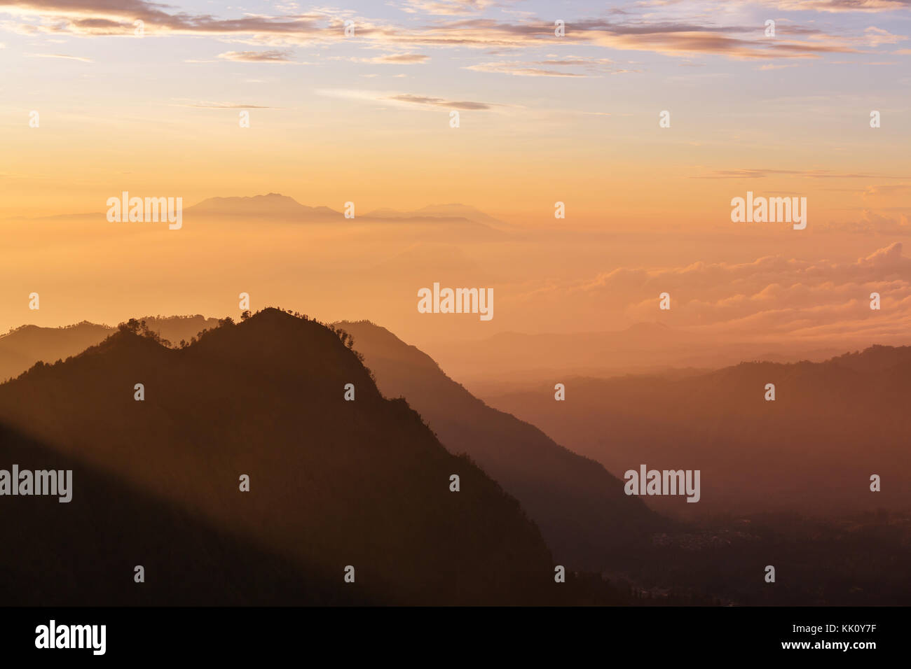 Fabulous light of sun rays at beautiful sunrise in mountains of Java ...