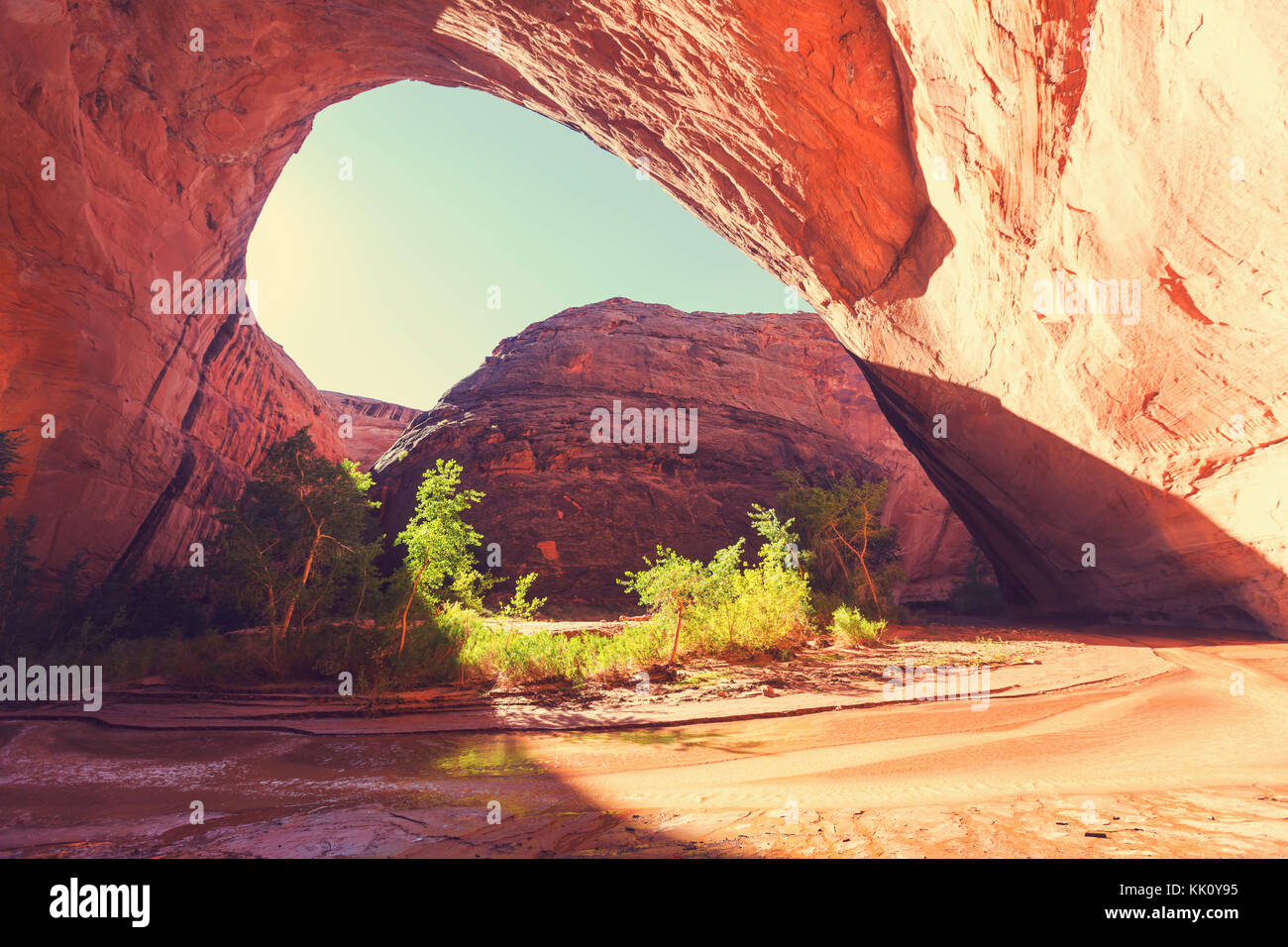 Hiker at jacob hamblin arch in coyote gulch hi-res stock photography ...