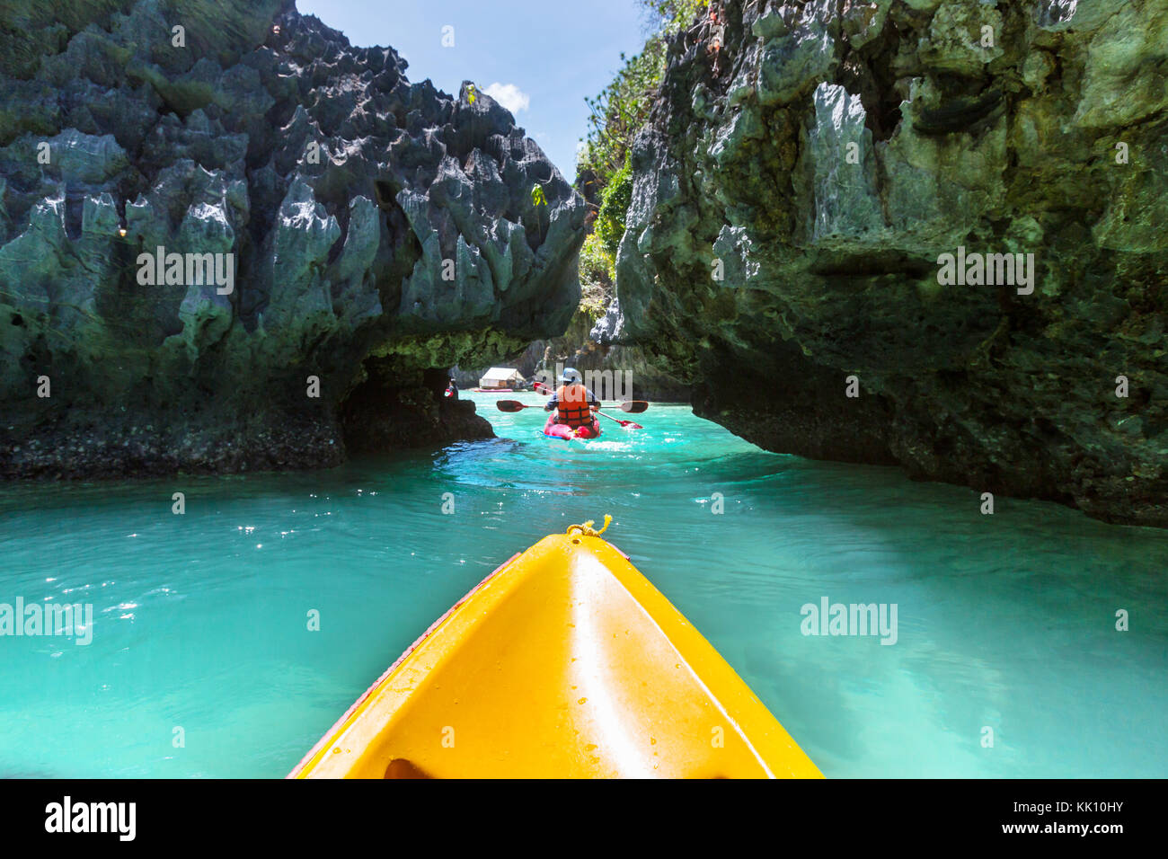 Kayak in the island lagoon between mountains. Kayaking journey in El ...