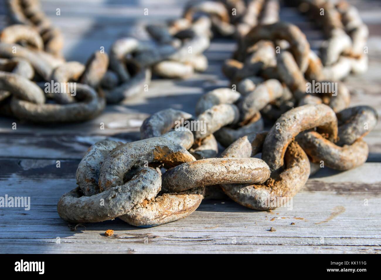 Anchor chain outstretched on the deck of a ship Stock Photo - Alamy