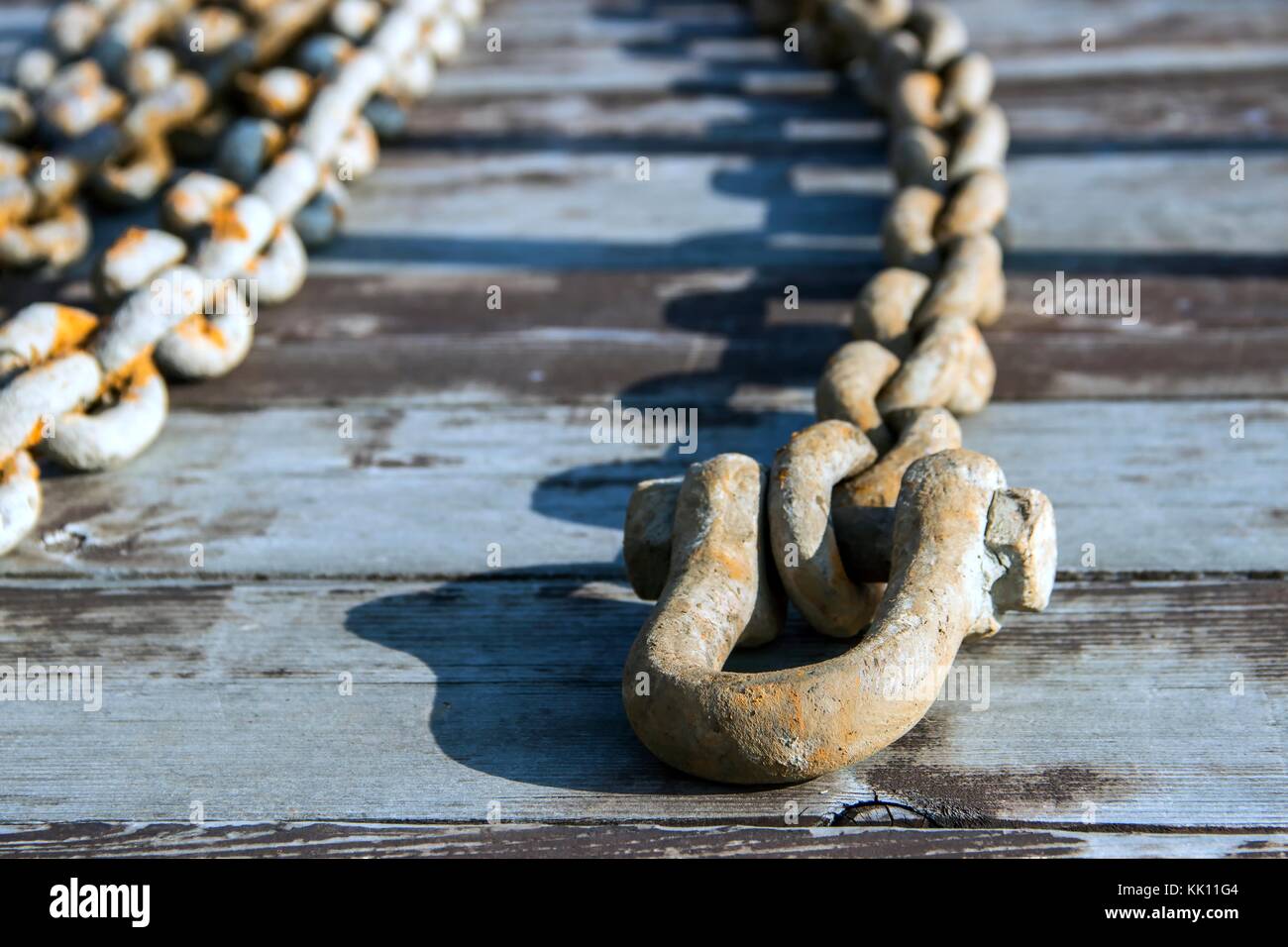Anchor chain outstretched on the deck of a ship Stock Photo - Alamy