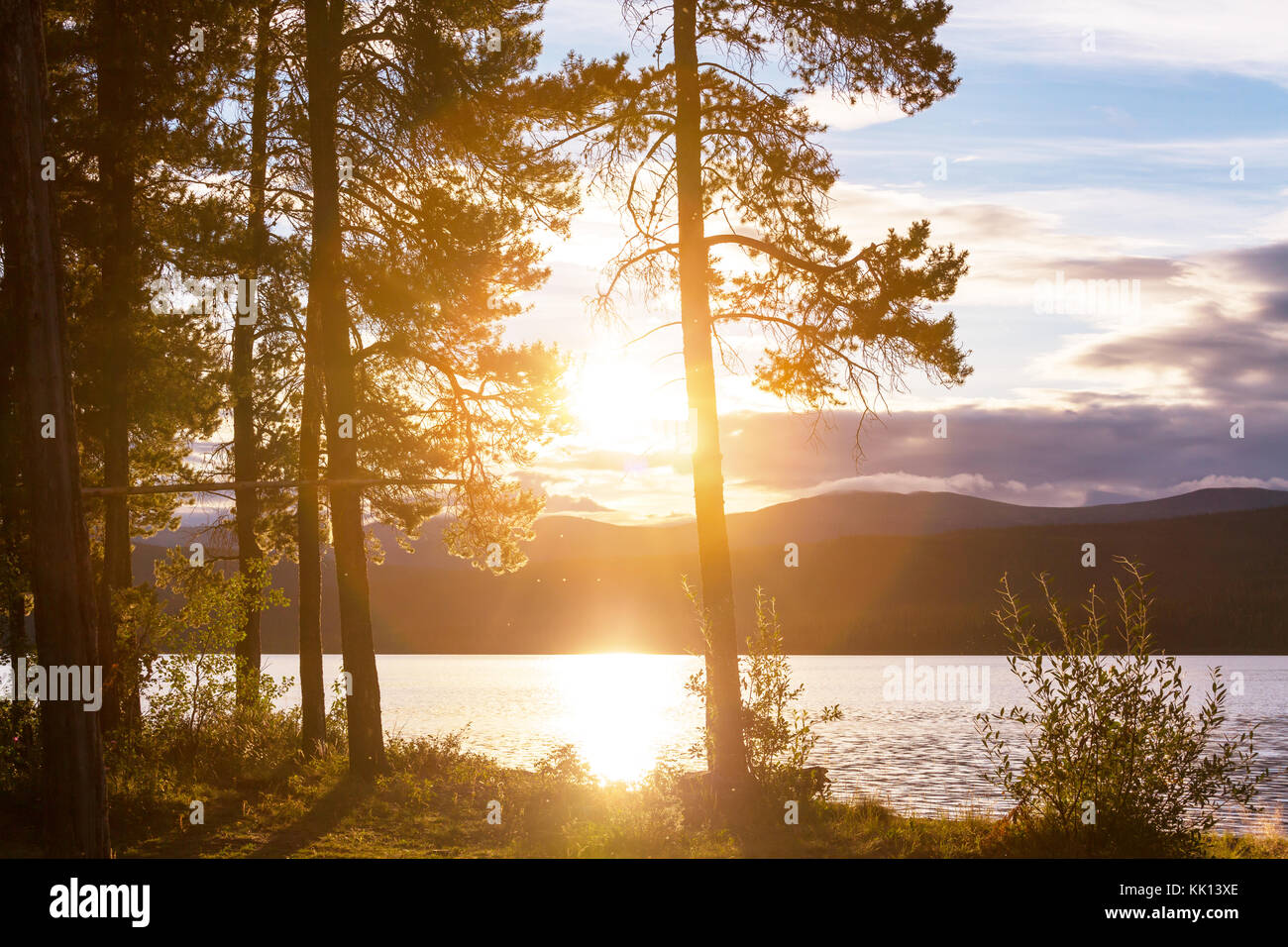 Sunrise scene on lake Stock Photo - Alamy