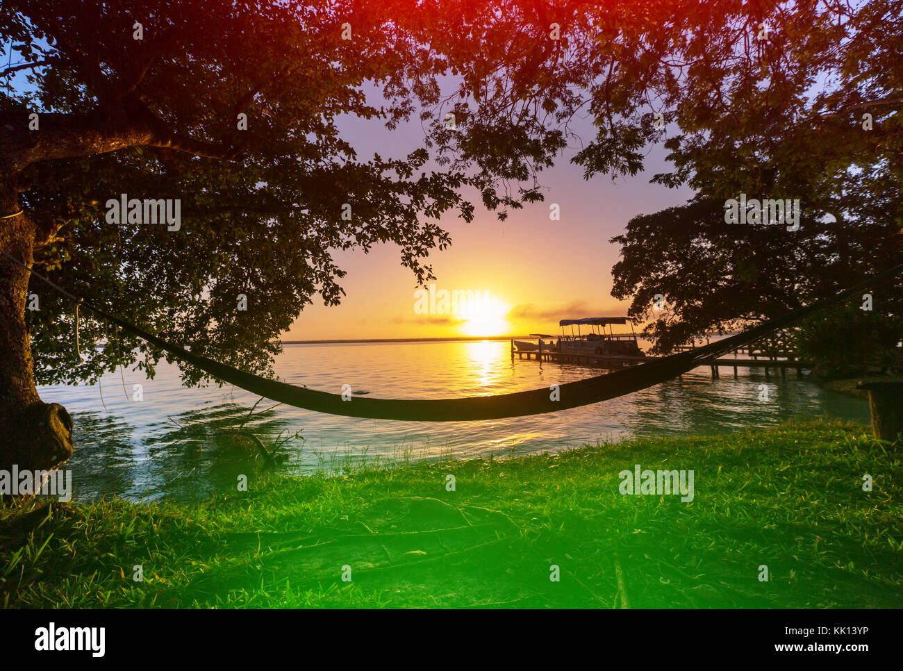 Sunset scene on lake Stock Photo - Alamy