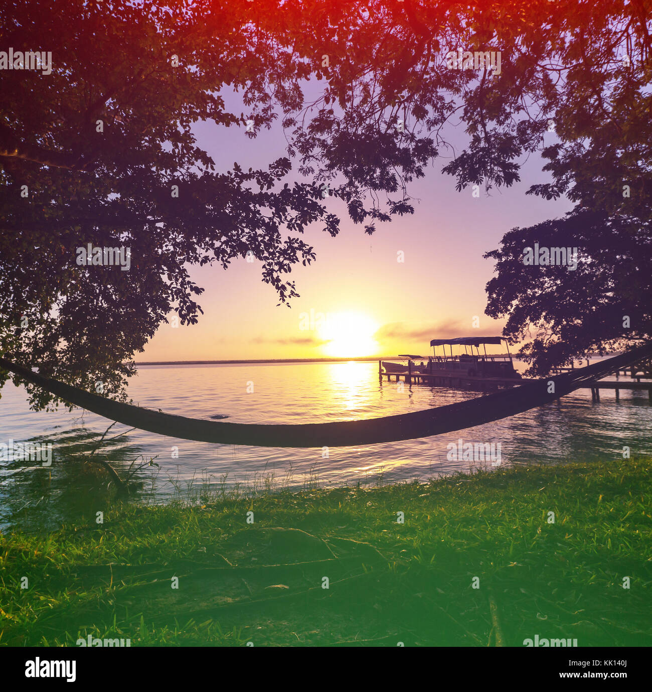 Sunset scene on lake Stock Photo - Alamy