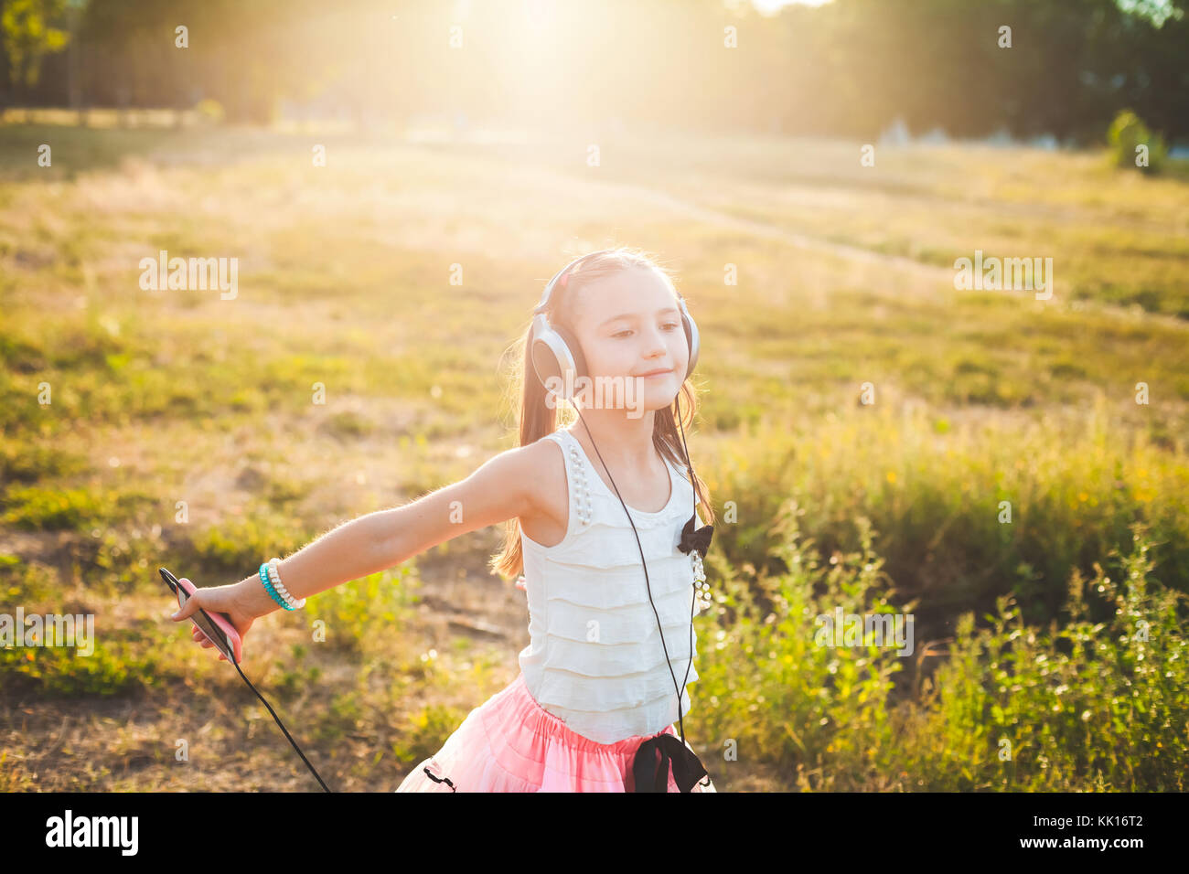 happy girl listening music and dancing Stock Photo - Alamy