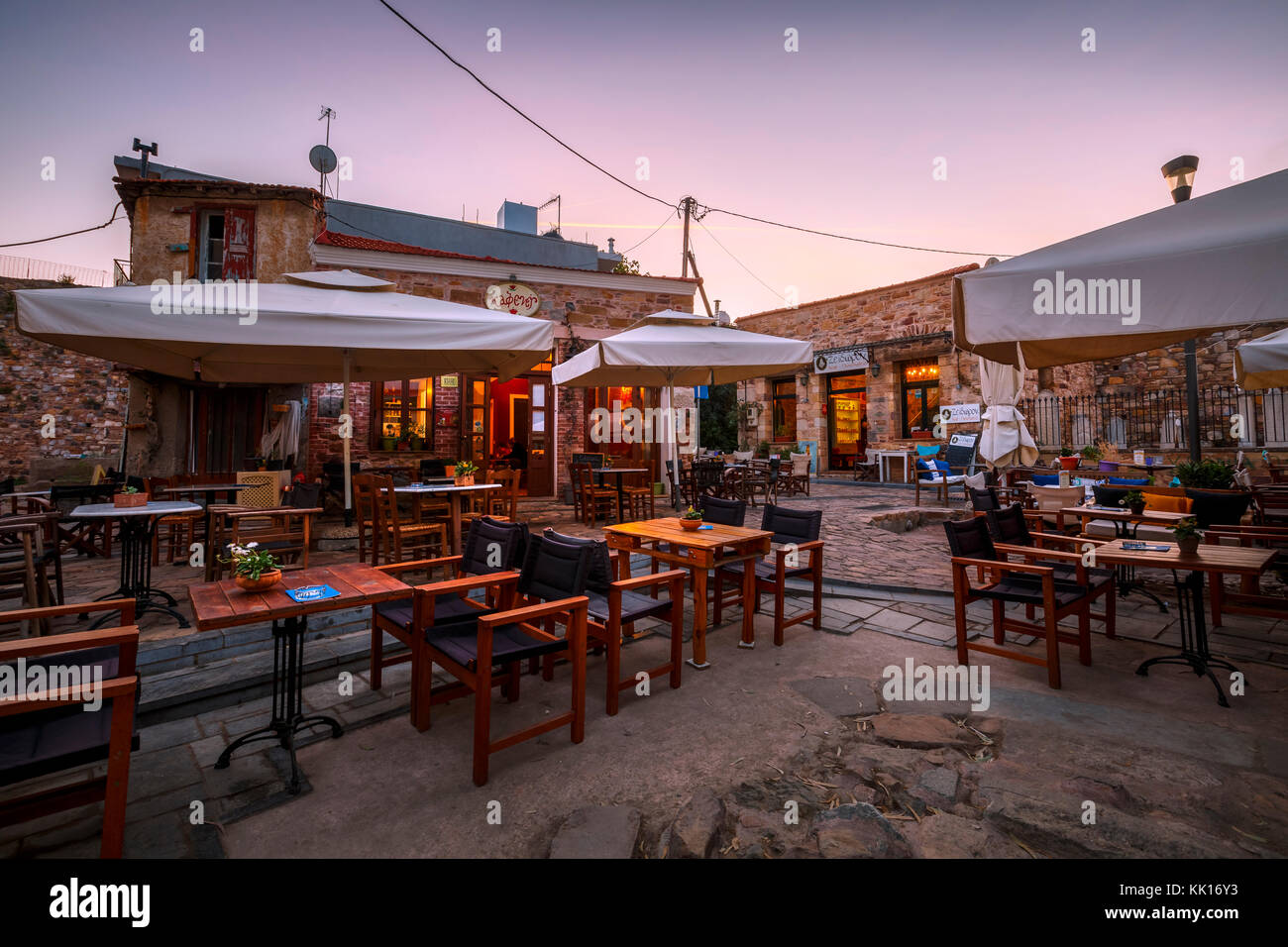 Bars and coffee shops in the central square of the old town of Chios in ...