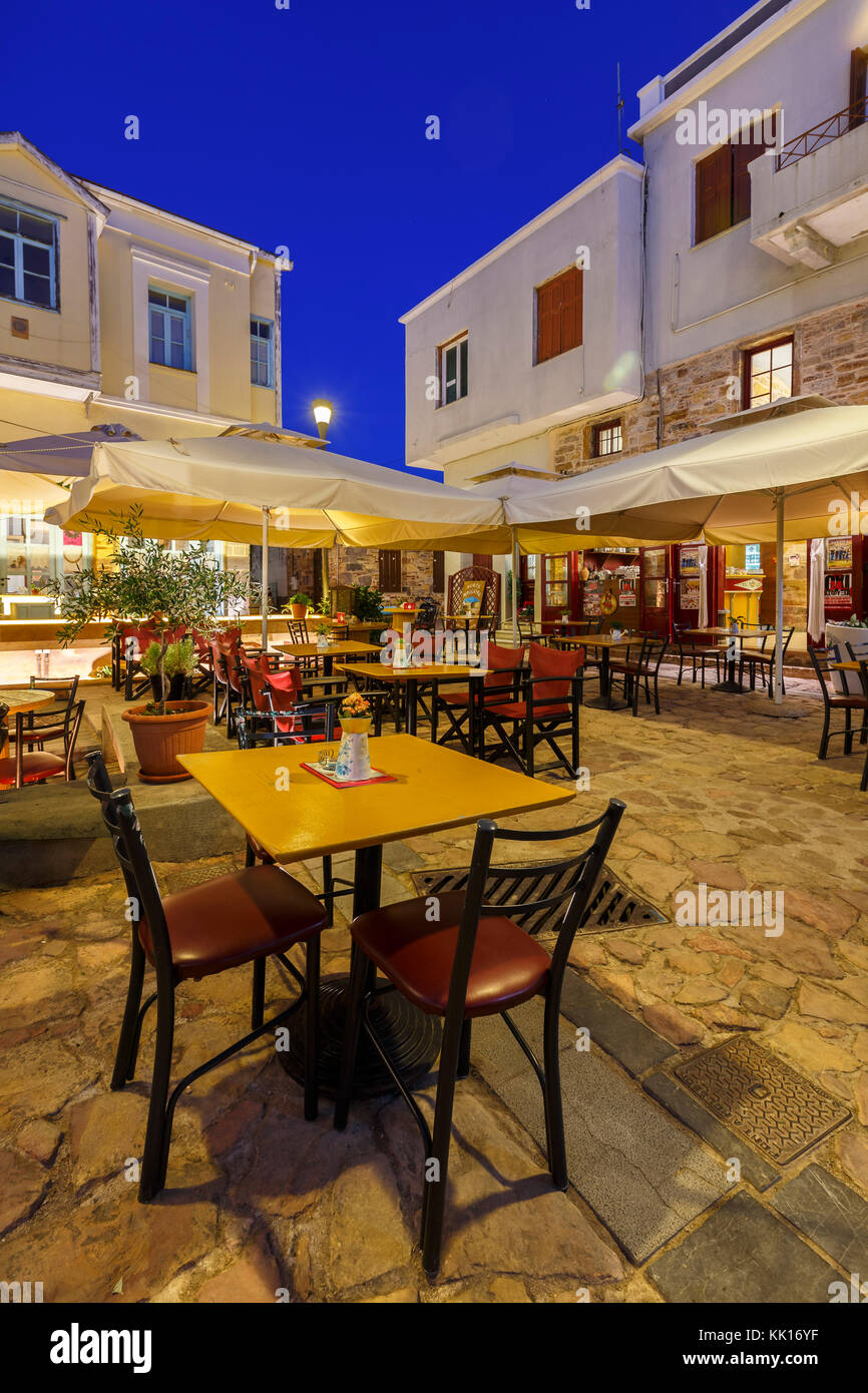 Bars and coffee shops in the central square of the old town of Chios in ...