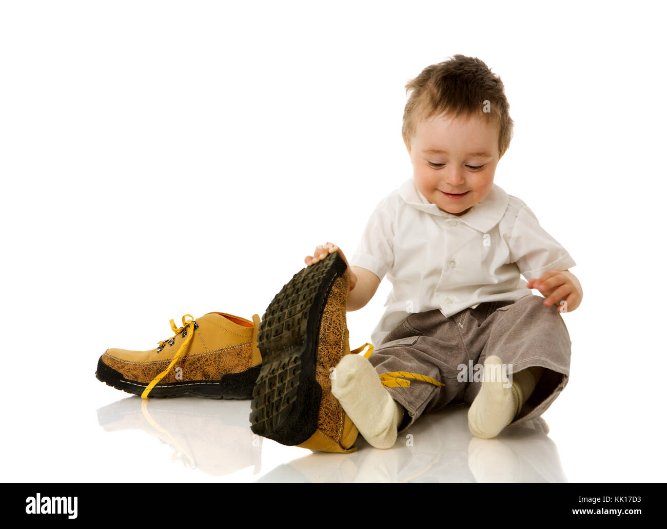 Child Wearing Big Shoes Stock Photos & Child Wearing Big Shoes Stock ...