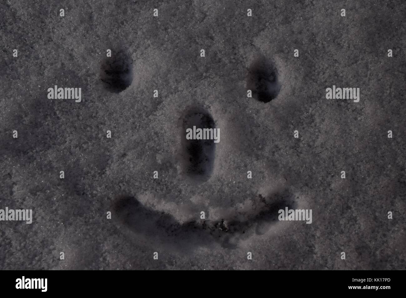 smiley face painted in fresh snow Stock Photo - Alamy