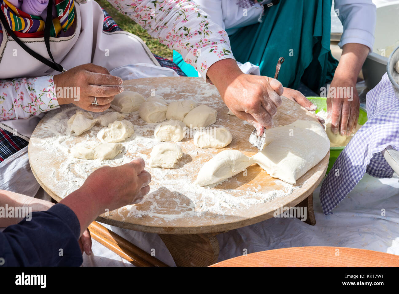 Woman Prepare traditional Turkish yufka for pastries(gozleme) with ...
