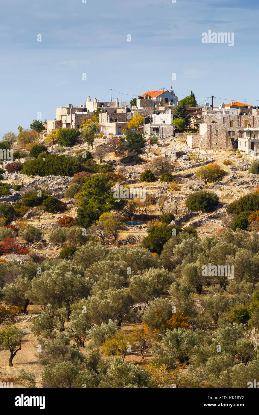 View of Avgonima village and surrounding gardens in autumn colours ...