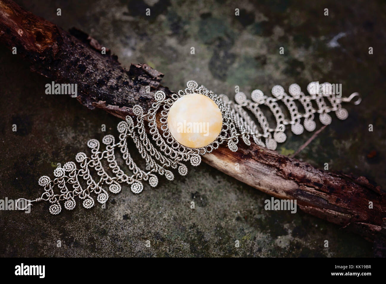 Beautiful jewelry art bracelet on natural background Stock Photo - Alamy